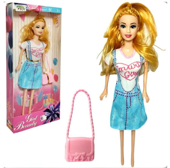Boneca de plástico tipo barbie de brinquedo com roupas e acessórios ...